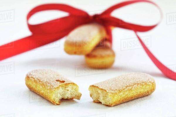 Sponge fingers with a red bow - Royalty-free Stock Photo | Dissolve