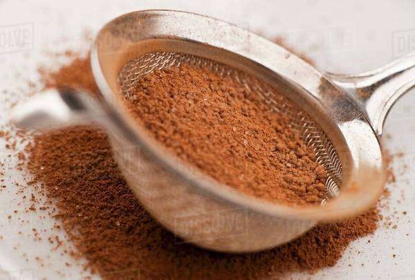 Cocoa Powder Mixed with Sugar in a Strainer - Stock Photo - Dissolve