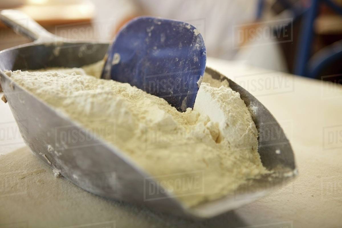Flour in a scoop - Stock Photo - Dissolve