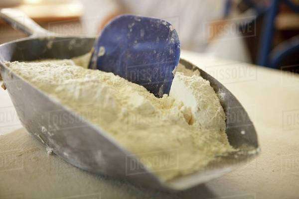 Flour in a scoop - Stock Photo - Dissolve