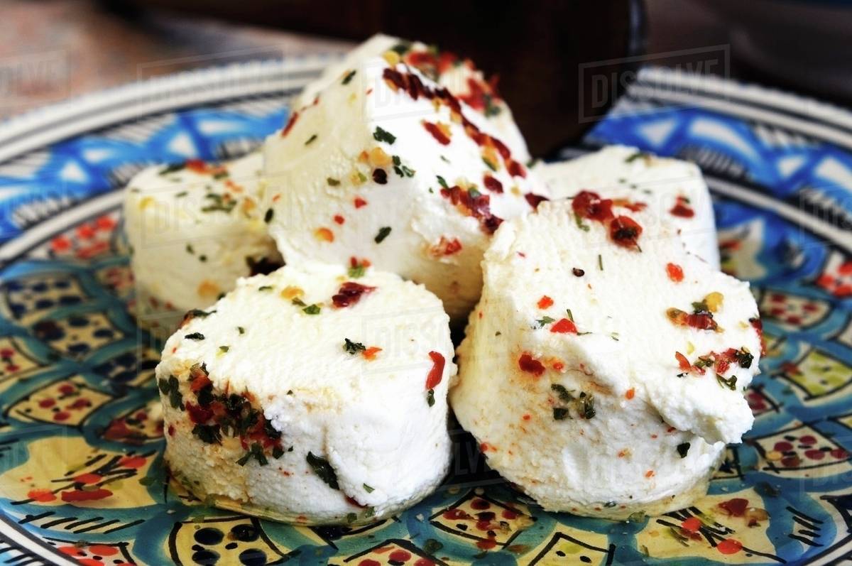 Marinated toma cheese with chilli and olive oil (Italy) - Stock Photo ...