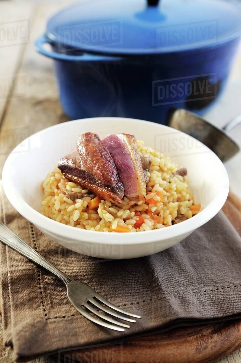 Risotto with wild duck breast - Stock Photo - Dissolve