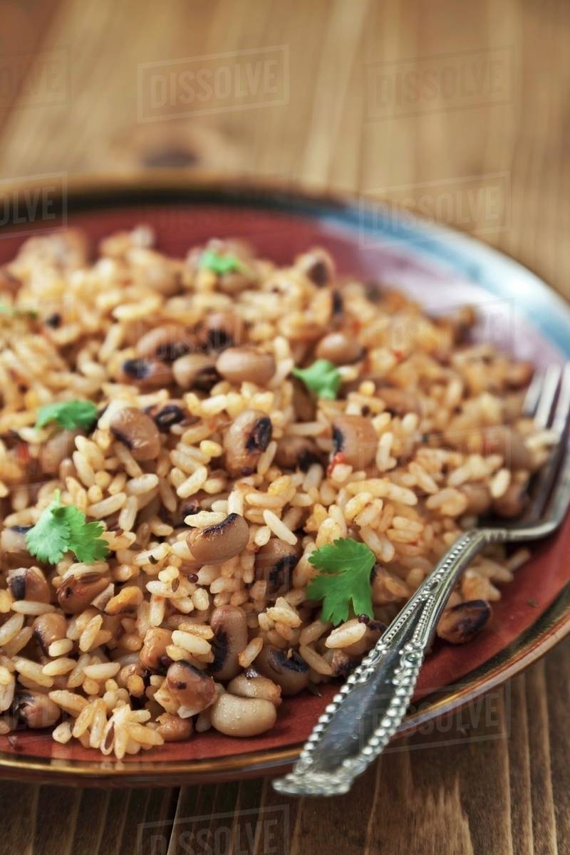 Rice and black eyed peas with cumin and mustard seeds topped with fresh ...
