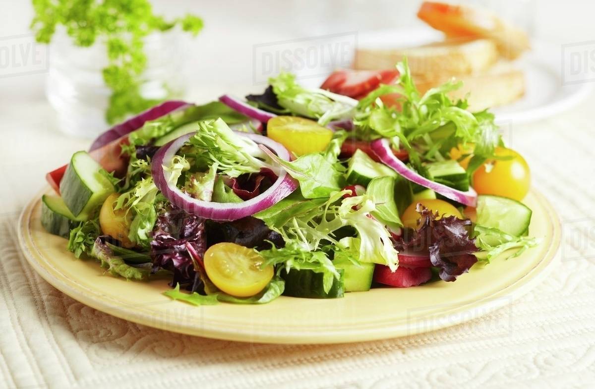 Mixed Green Salad on a Plate - Royalty-free Stock Photo | Dissolve