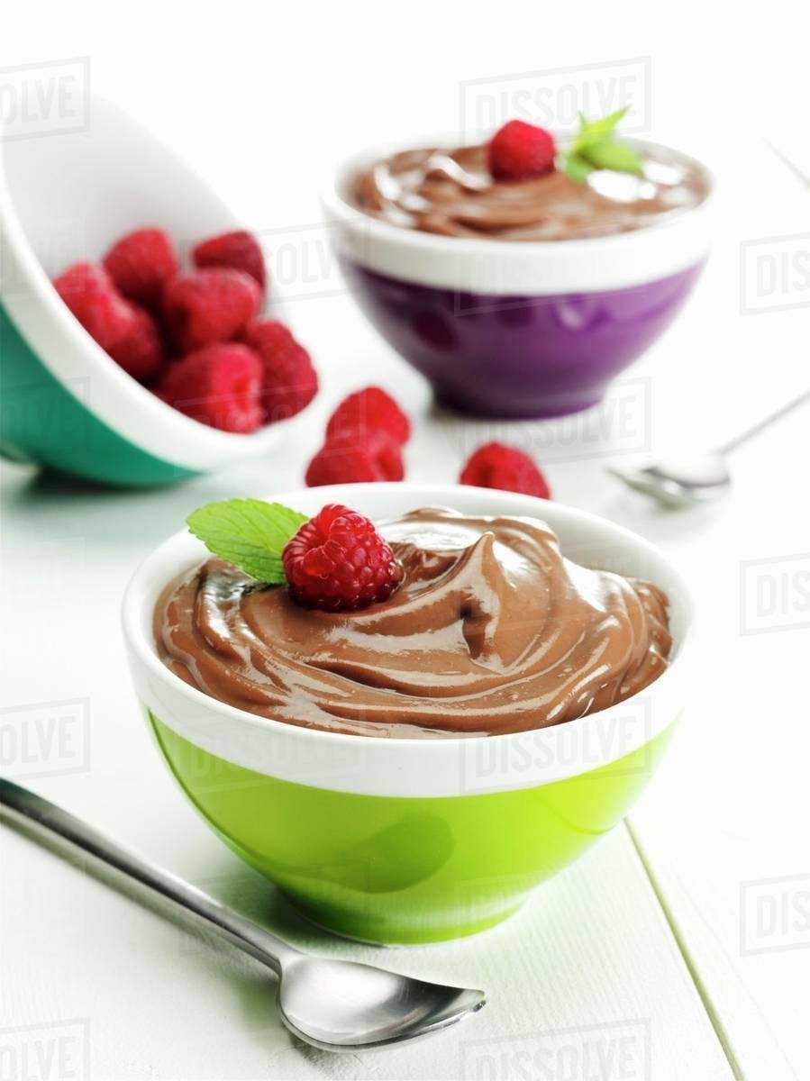 Bowls of Chocolate Pudding with Raspberries - Stock Photo - Dissolve