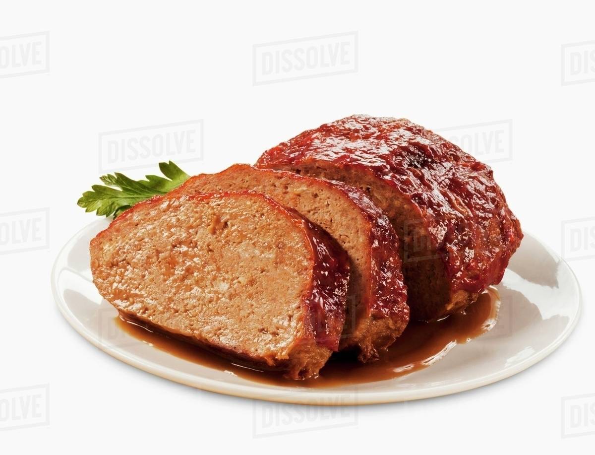 Partially Sliced Meatloaf on a Plate; White Background - Stock Photo ...