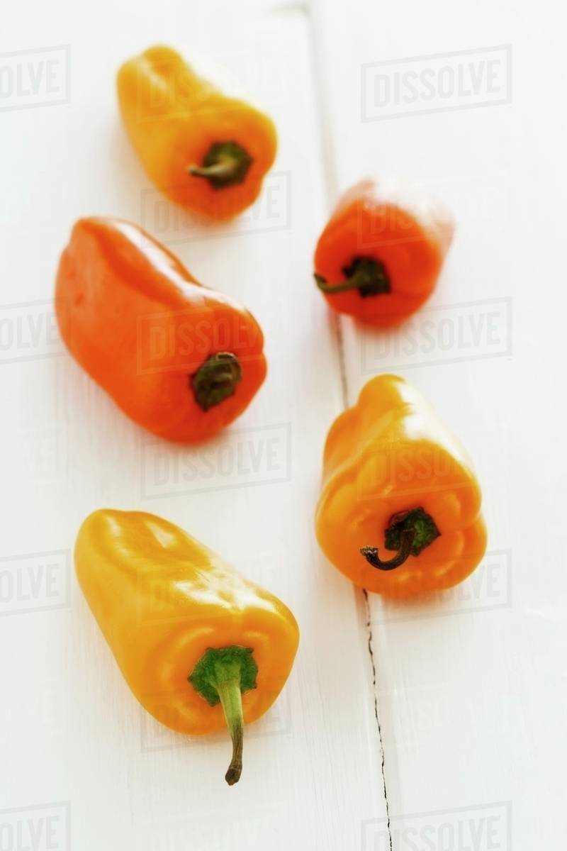 Yellow and orange mini peppers - Royalty-free Stock Photo | Dissolve