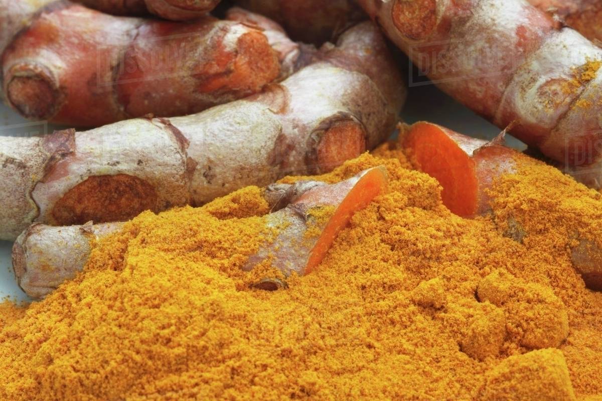 Turmeric roots and powder - Royalty-free Stock Photo | Dissolve