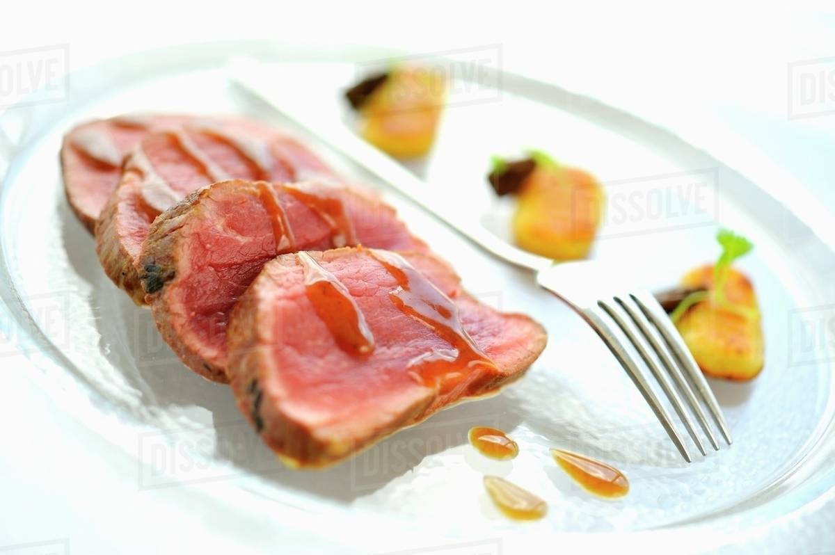 Veal fillet with gravy and gnocchi - Stock Photo - Dissolve