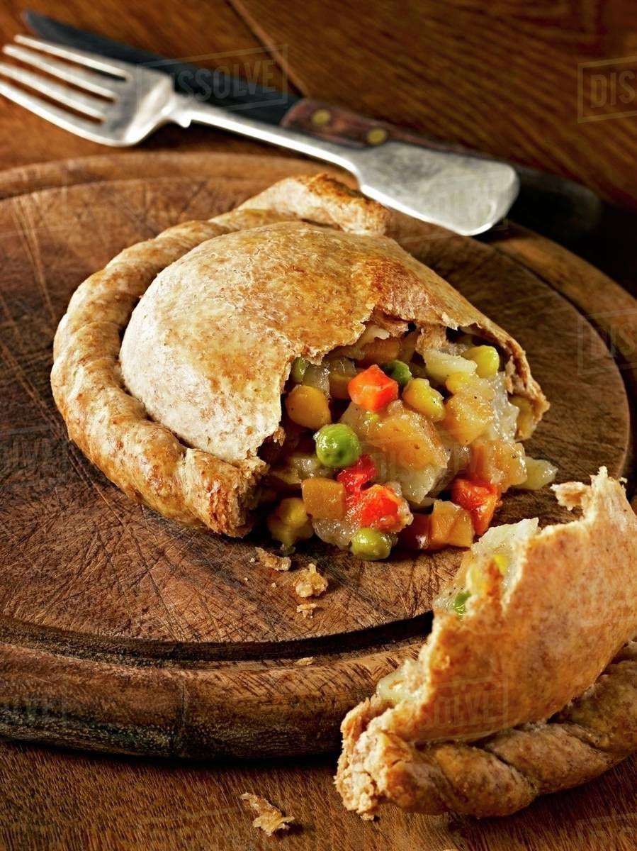 Wholemeal vegetable pasty, cut - Royalty-free Stock Photo | Dissolve