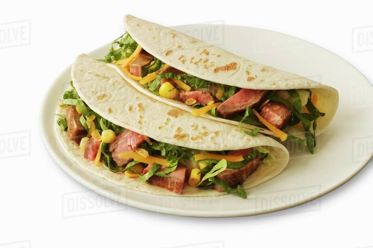 Two Beef Soft Tacos on a White Plate; White Background - Royalty-free ...