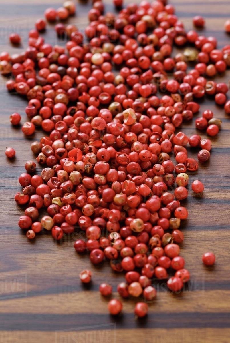 Heap of red peppercorns - Stock Photo - Dissolve