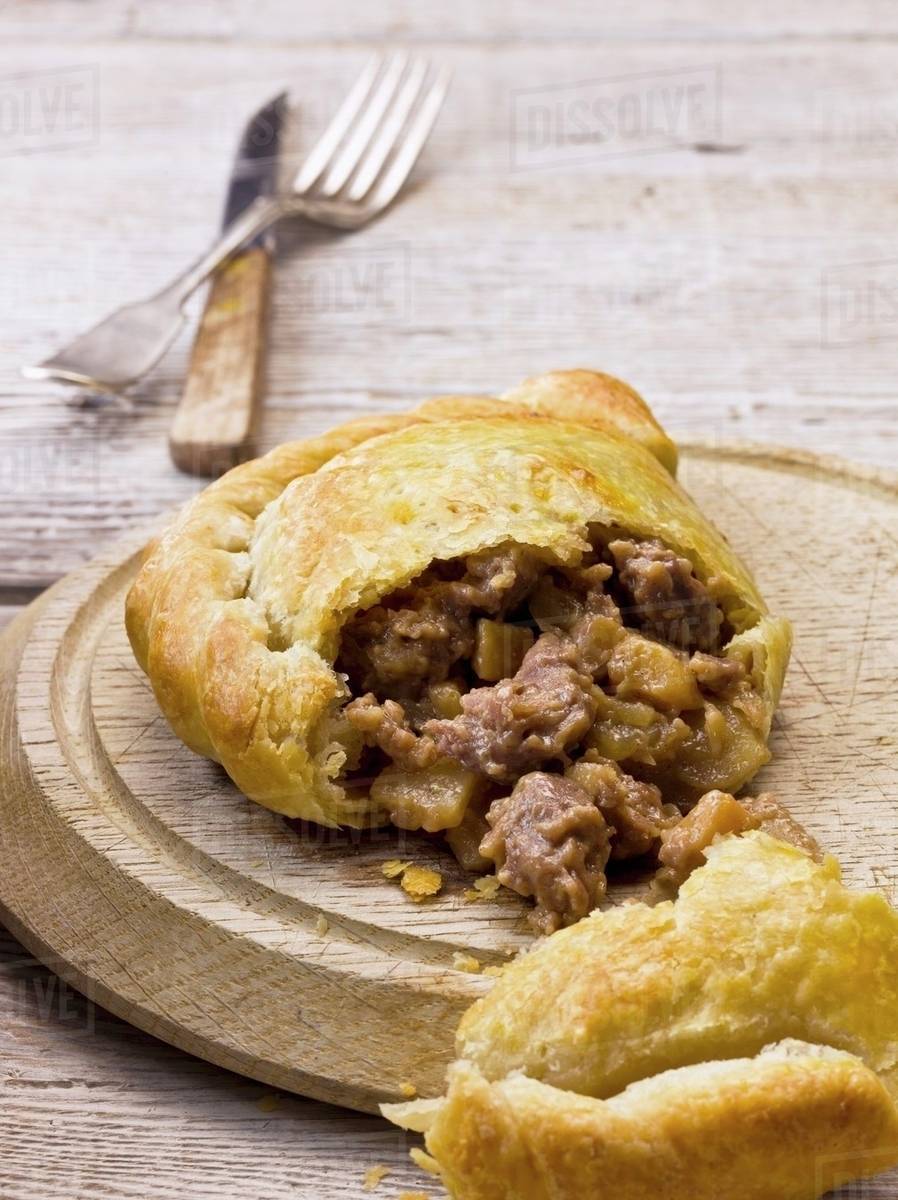 Beef and Stilton pasty, sliced open (England) - Stock Photo - Dissolve