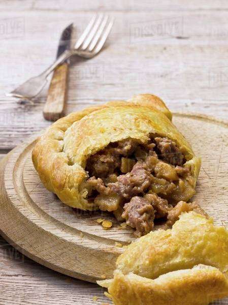 Beef and Stilton pasty, sliced open (England) - Stock Photo - Dissolve
