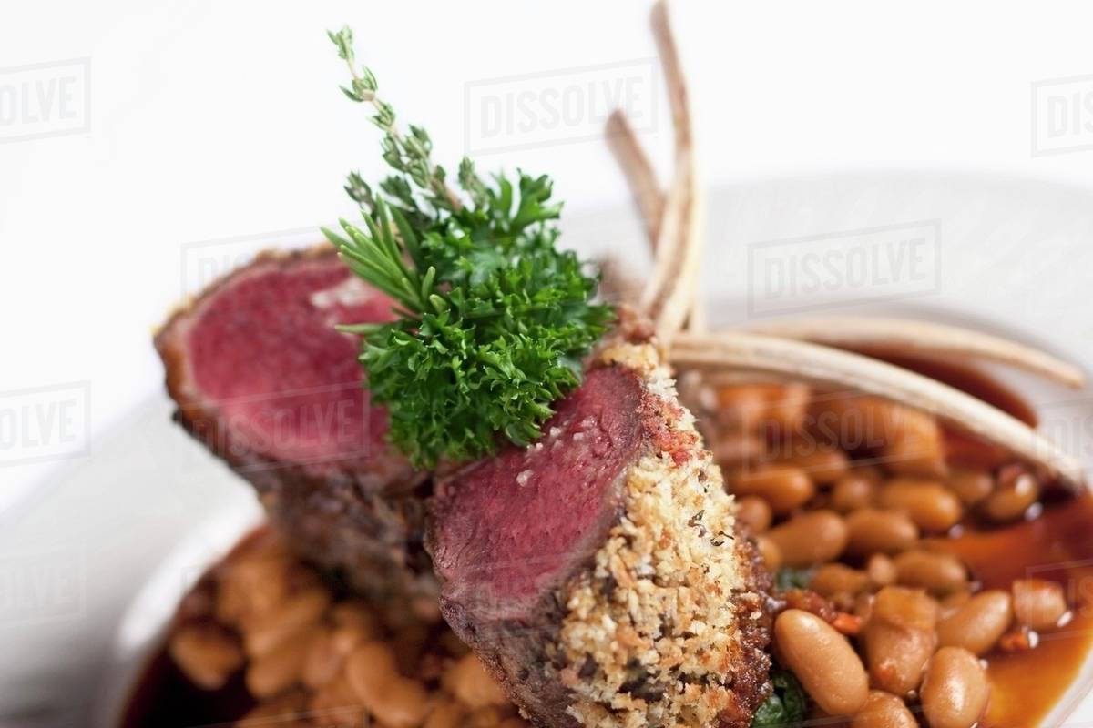 Breaded Rack of Lamb with Baked Beans - Stock Photo - Dissolve