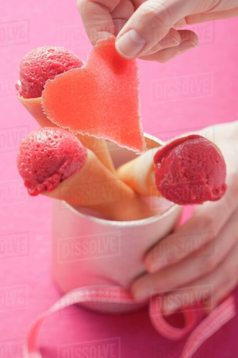 Three ice cream cones and a red heart - Royalty-free Stock Photo | Dissolve