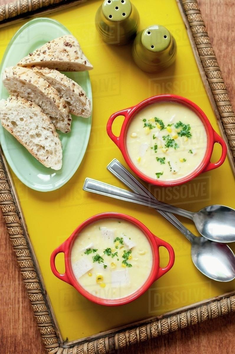 Chicken and corn chowder with bread - Royalty-free Stock Photo | Dissolve