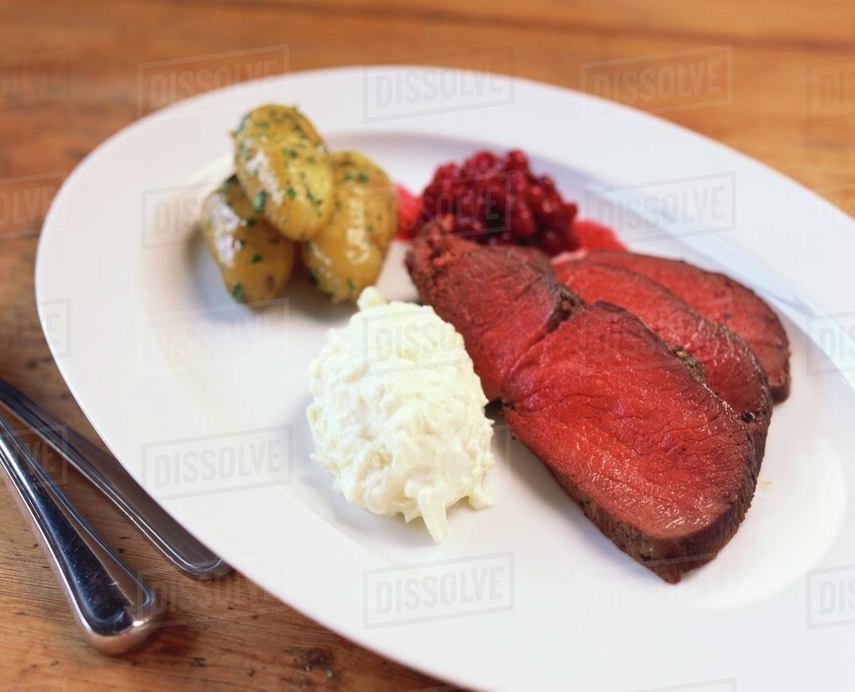 Venison fillet with apple cream and potatoes - Royalty-free Stock Photo ...