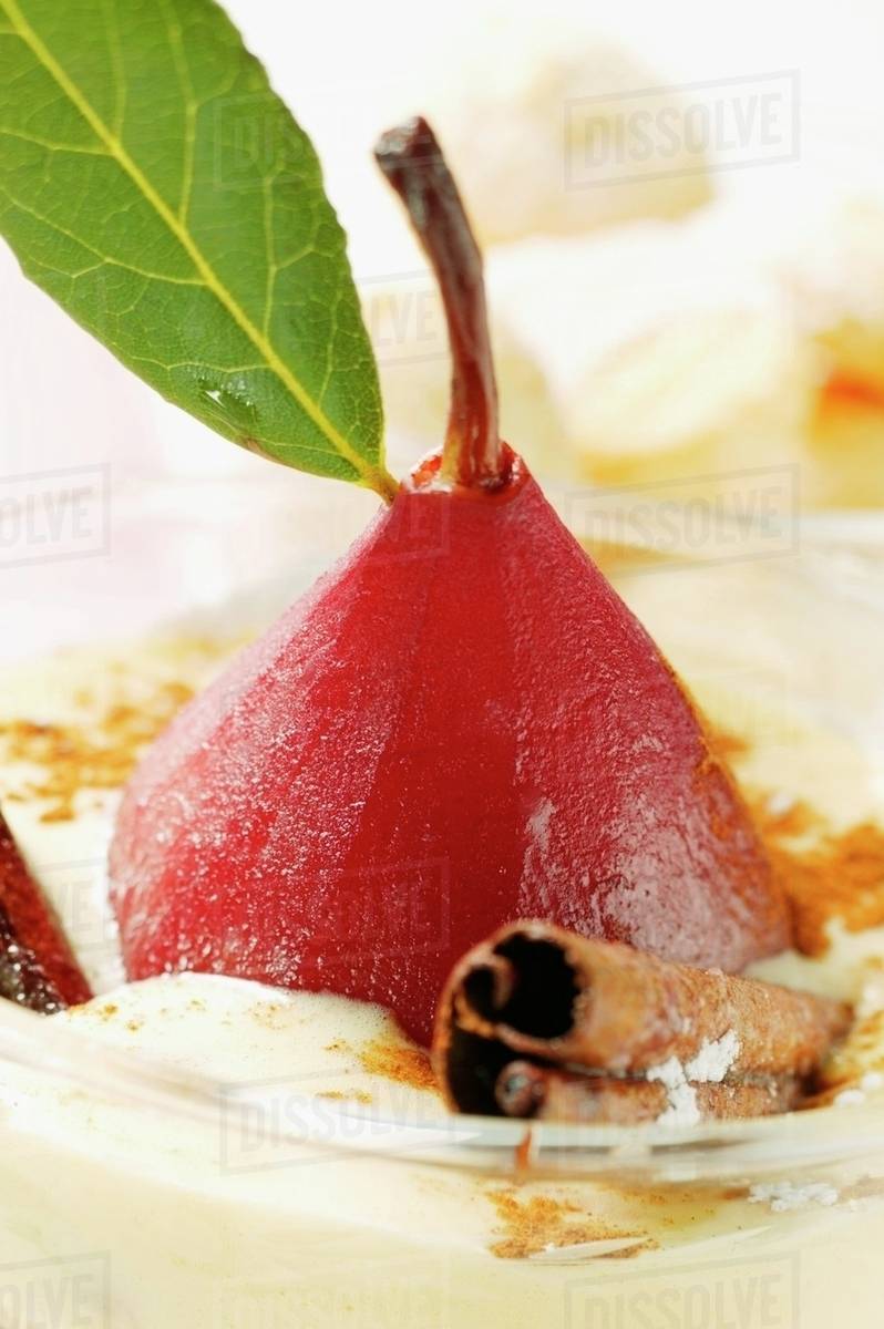 Pear in red wine with cinnamon in Madeira cream - Royalty-free Stock ...