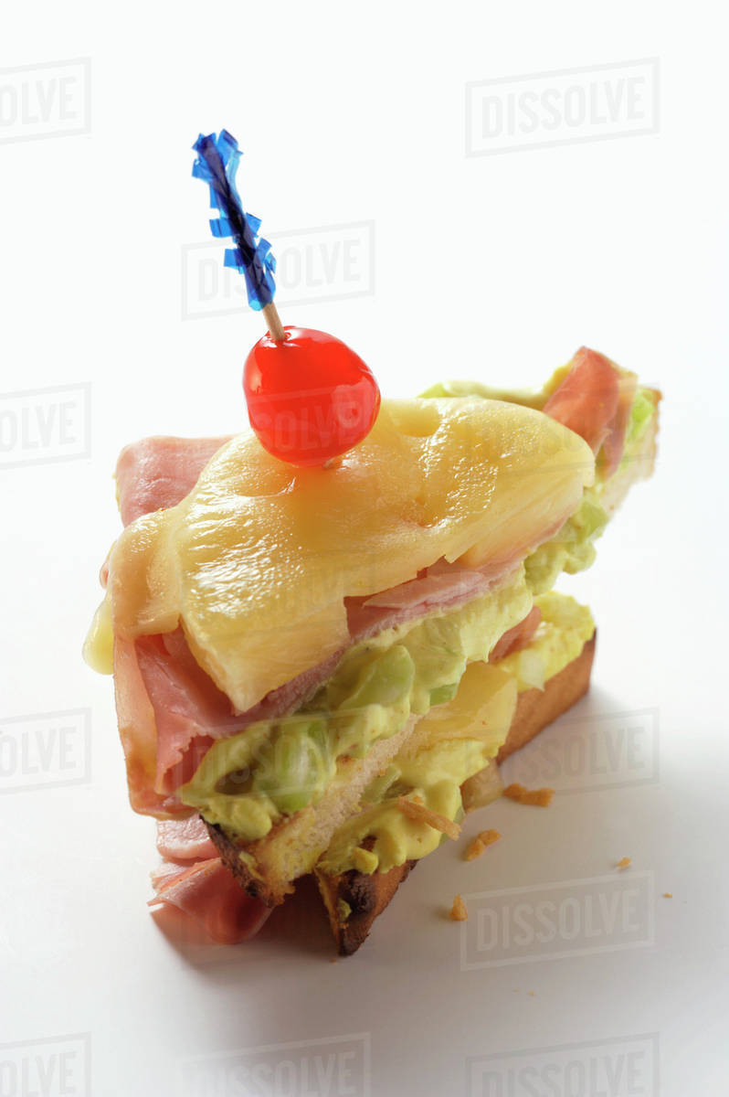 Ham & cheese on toast with pineapple, avocado cream & cherry - Stock ...