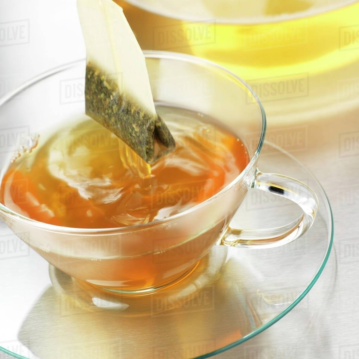 Taking tea bag out of cup - Royalty-free Stock Photo | Dissolve