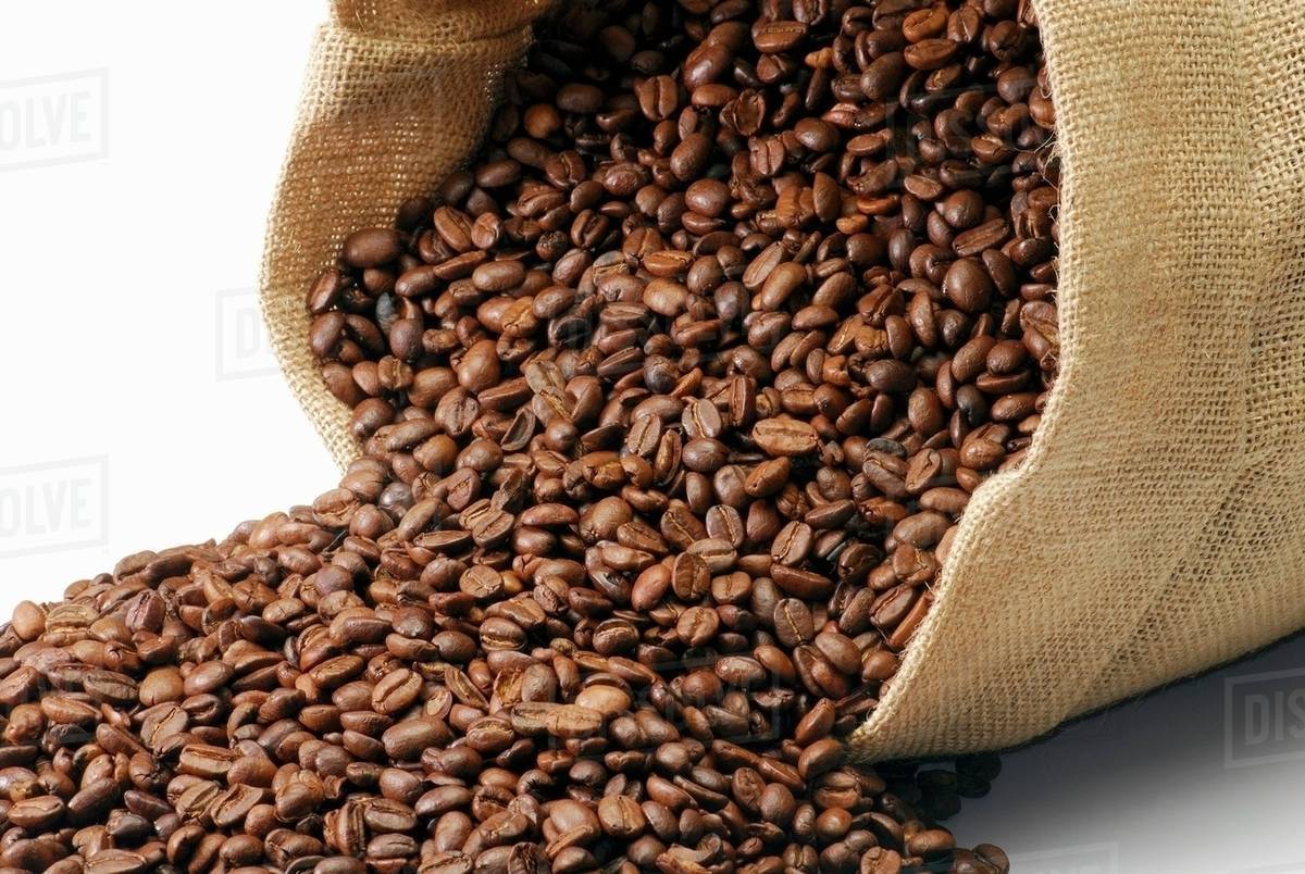 Spilt jute sack full of coffee beans - Royalty-free Stock Photo | Dissolve