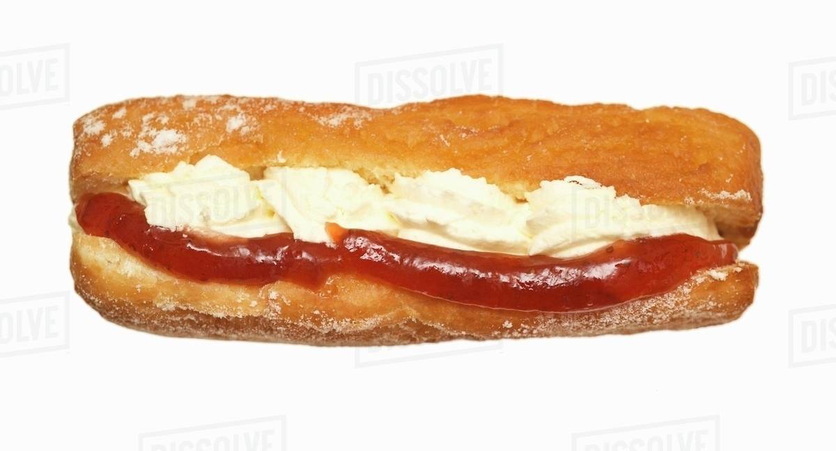 Long cream and jam doughnut - Stock Photo - Dissolve