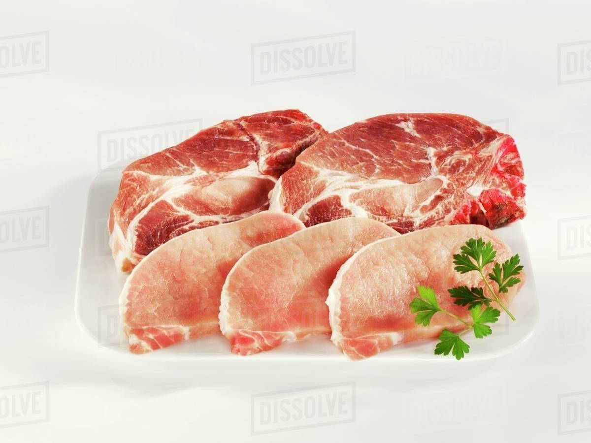 Slices of pork neck and loin - Stock Photo - Dissolve