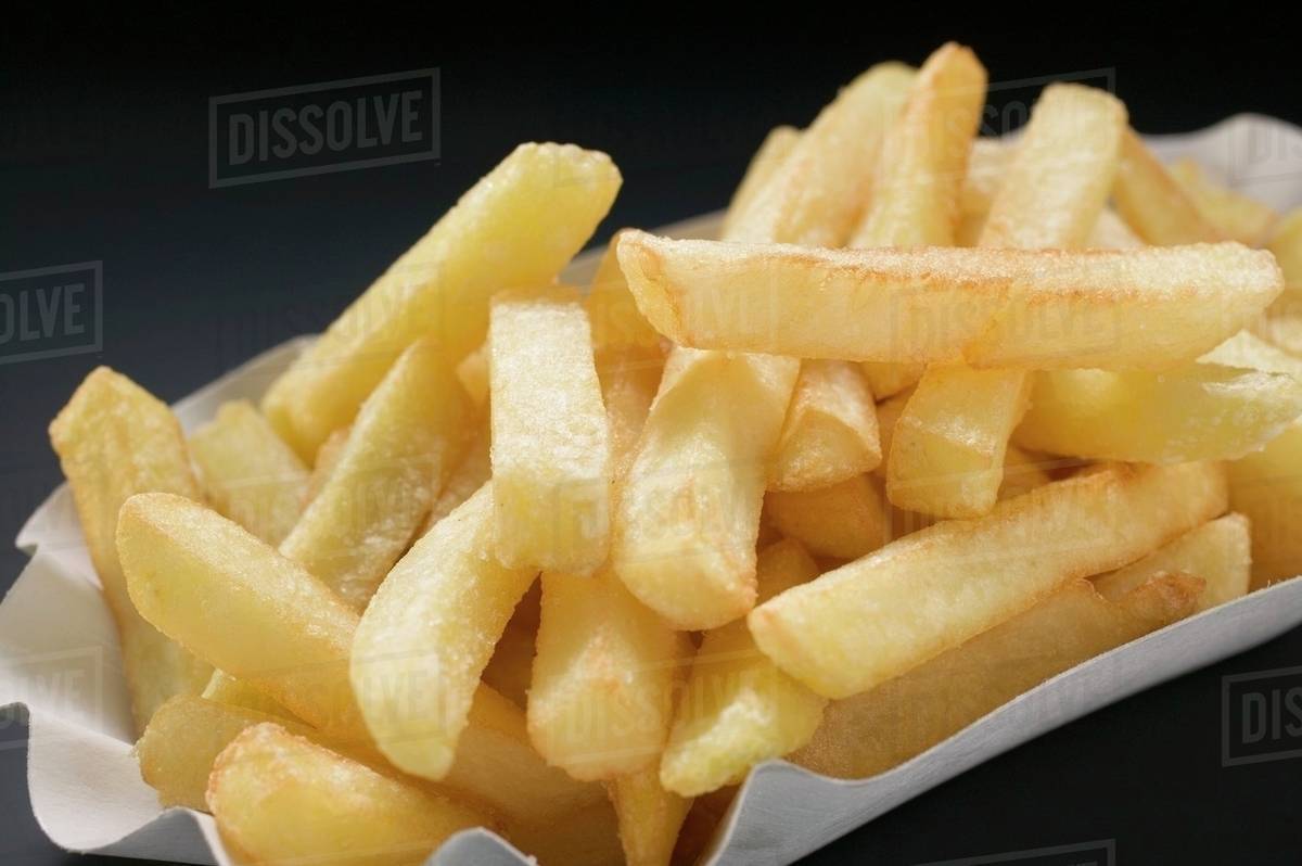 Chips in a paper dish - Royalty-free Stock Photo | Dissolve