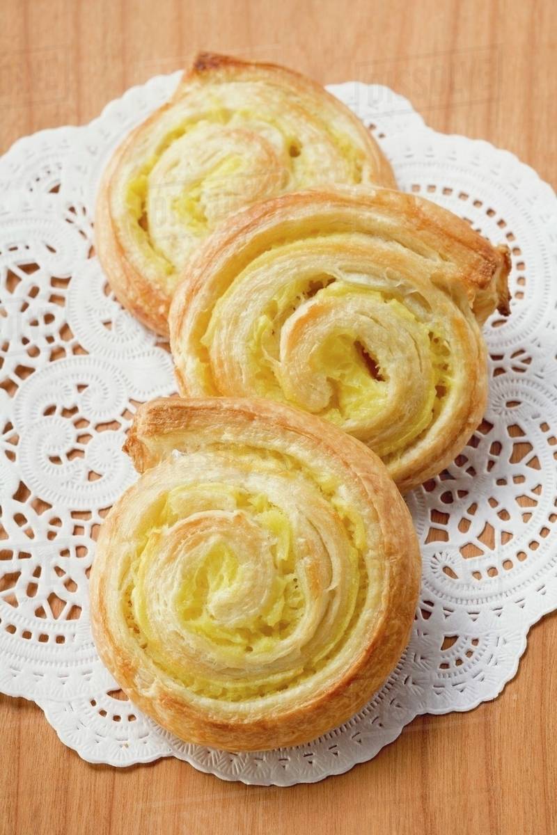 Three Danish pastry snails with custard filling - Royalty-free Stock ...