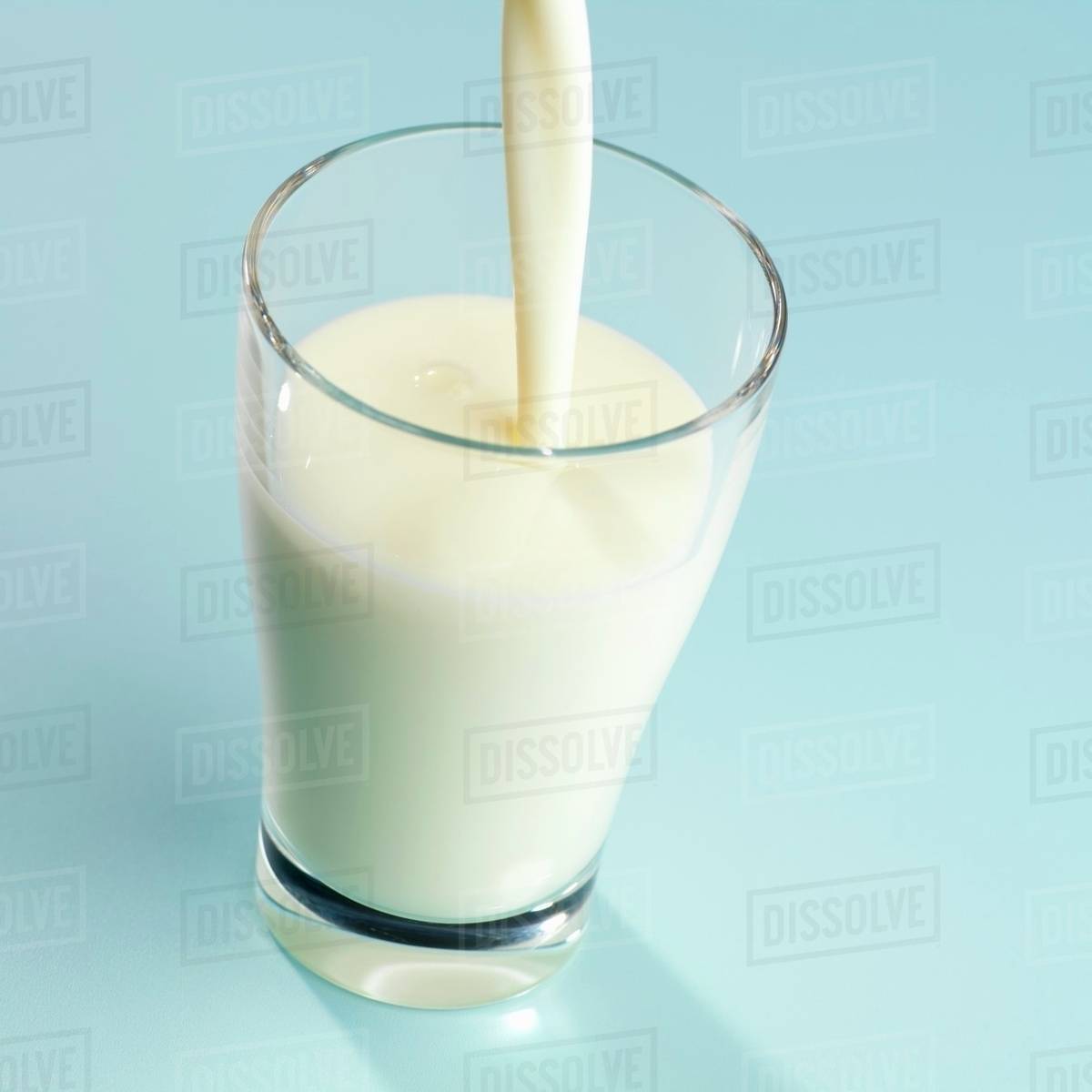 Pouring a glass of buttermilk - Royalty-free Stock Photo | Dissolve