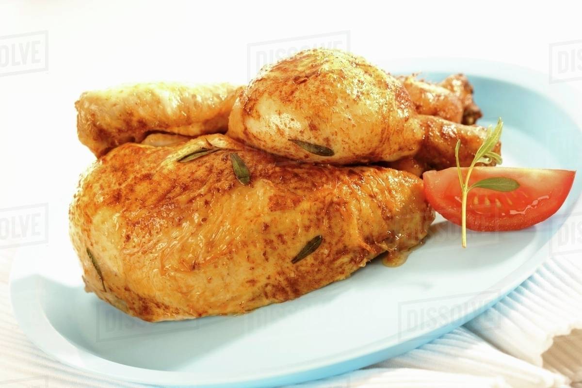 Half a roast chicken - Royalty-free Stock Photo | Dissolve