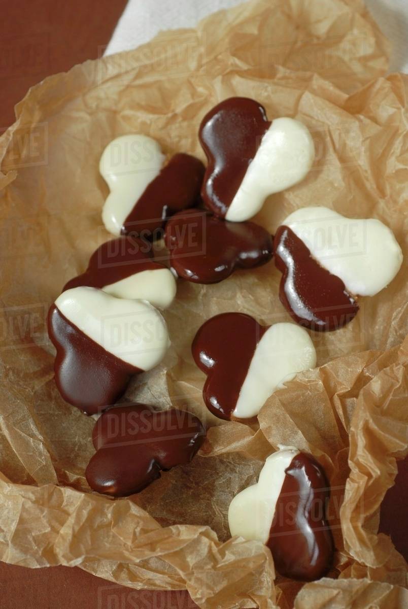 Biscuits with two-coloured icing - Stock Photo - Dissolve