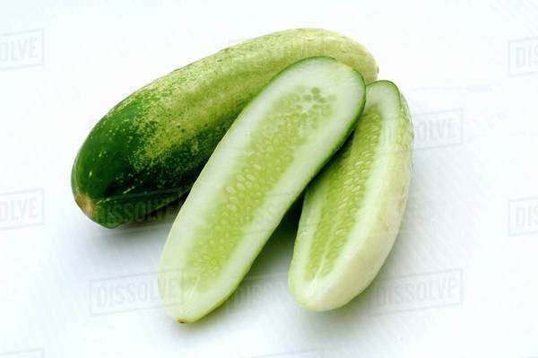 Whole and half cucumbers - Royalty-free Stock Photo | Dissolve
