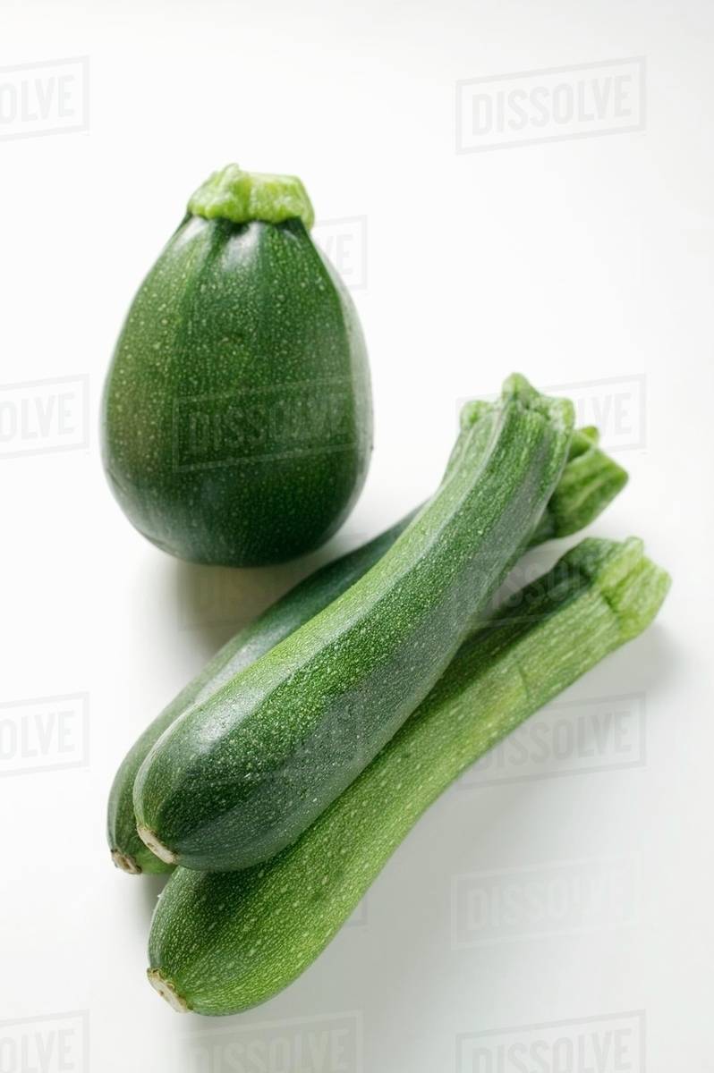 Round and long courgettes - Royalty-free Stock Photo | Dissolve