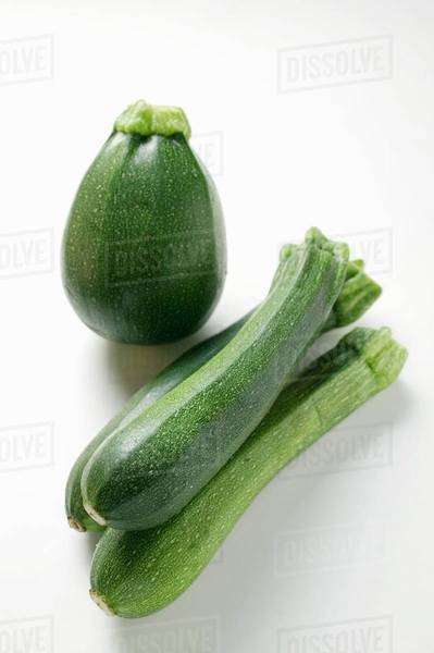 Round and long courgettes - Royalty-free Stock Photo | Dissolve