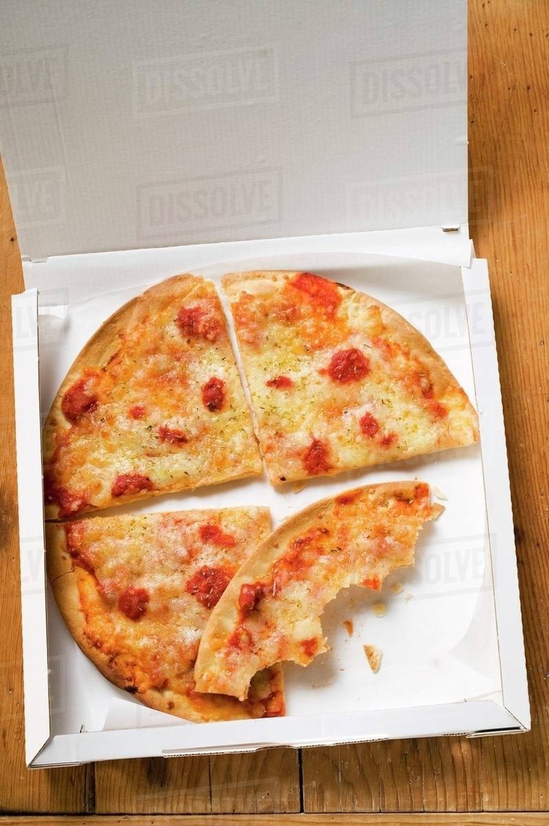 Pizza Margherita, in slices in pizza box - Royalty-free Stock Photo ...