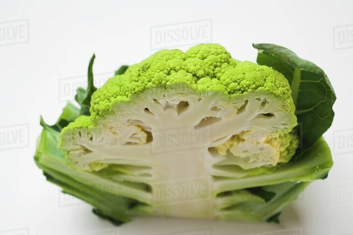 Green cauliflower, half - Royalty-free Stock Photo | Dissolve