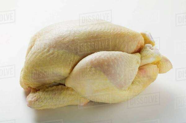 Fresh oven-ready chicken - Stock Photo - Dissolve