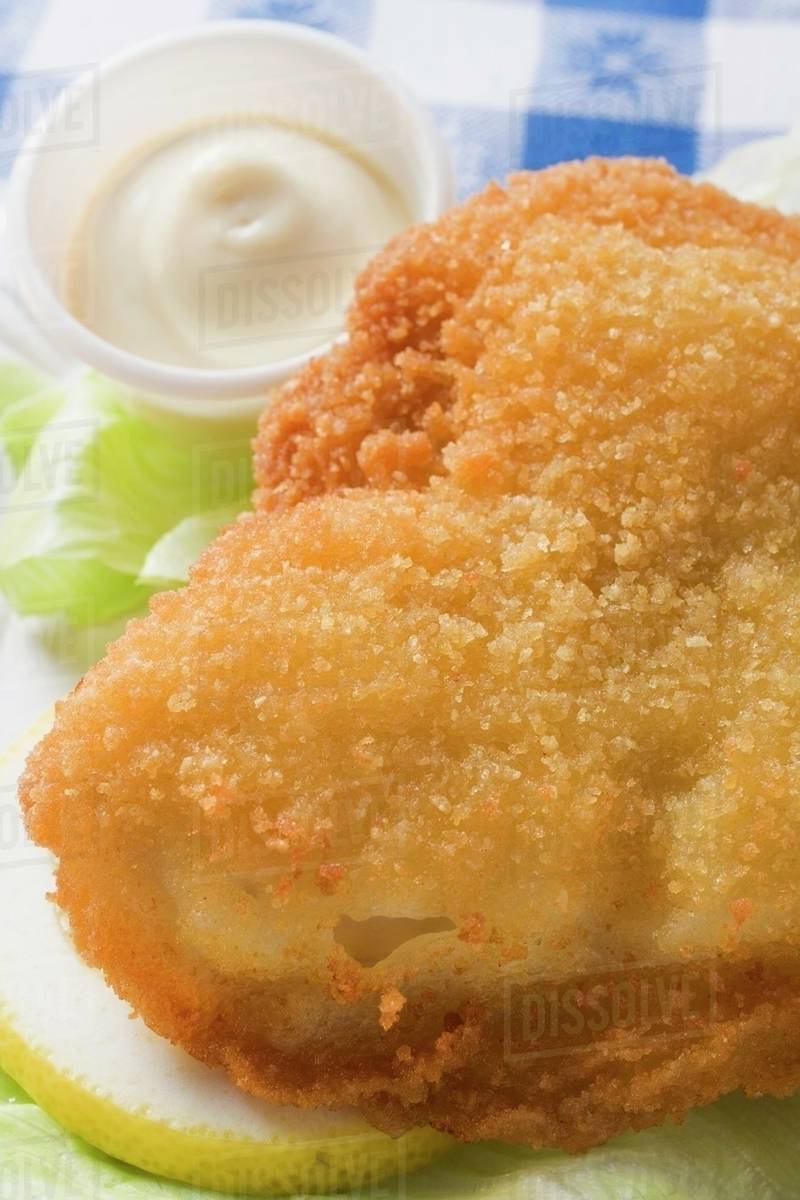 Breaded fish fillet with mayonnaise (close-up) - Royalty-free Stock ...