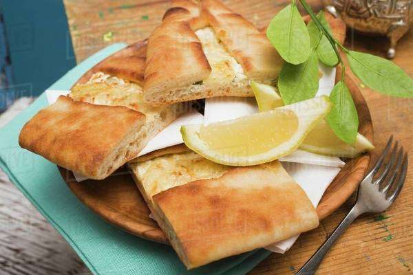 Pide (Turkish flatbread) with sheep's cheese filling - Royalty-free ...