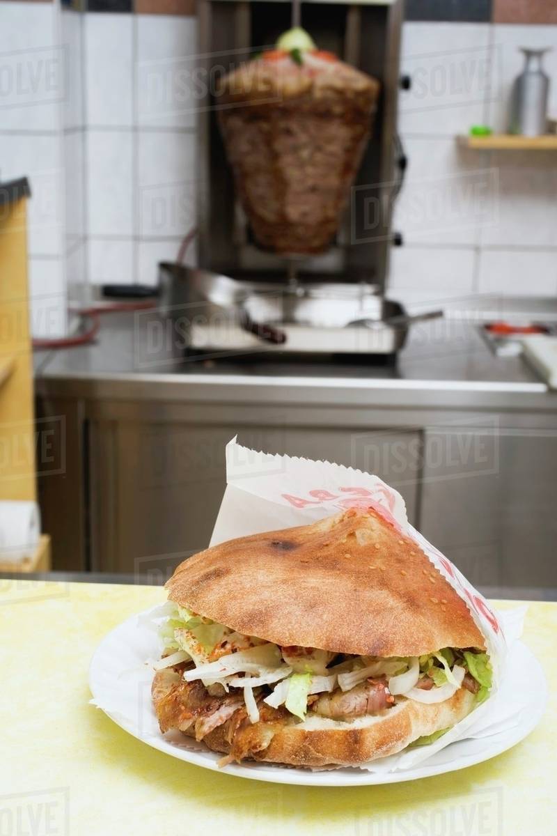 Doner kebab on snack bar counter - Royalty-free Stock Photo | Dissolve