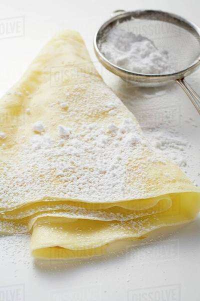 Folded crepe with icing sugar - Royalty-free Stock Photo | Dissolve