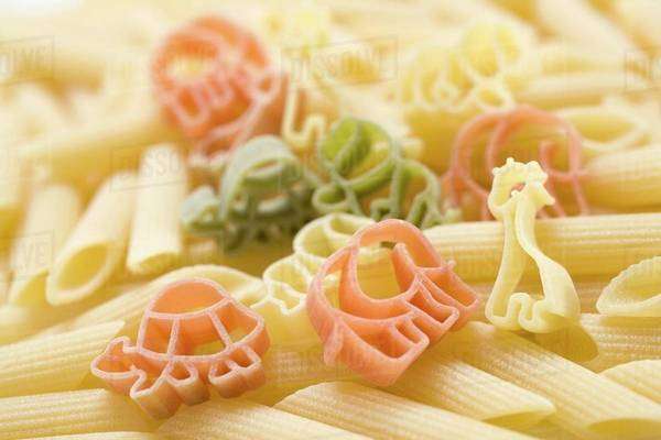 Coloured animal-shaped pasta and penne - Royalty-free Stock Photo ...