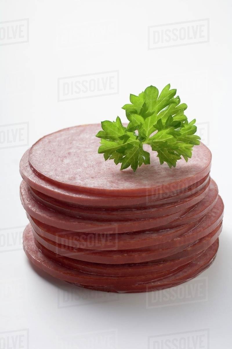 Sausage slices in a pile - Stock Photo - Dissolve