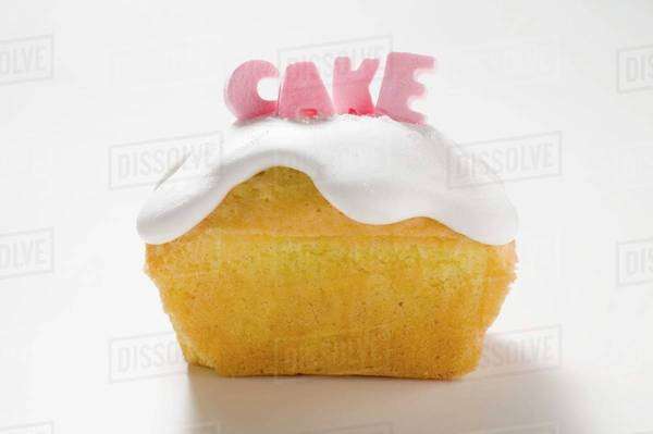 Iced loaf cake with the word 'Cake' - Royalty-free Stock Photo | Dissolve