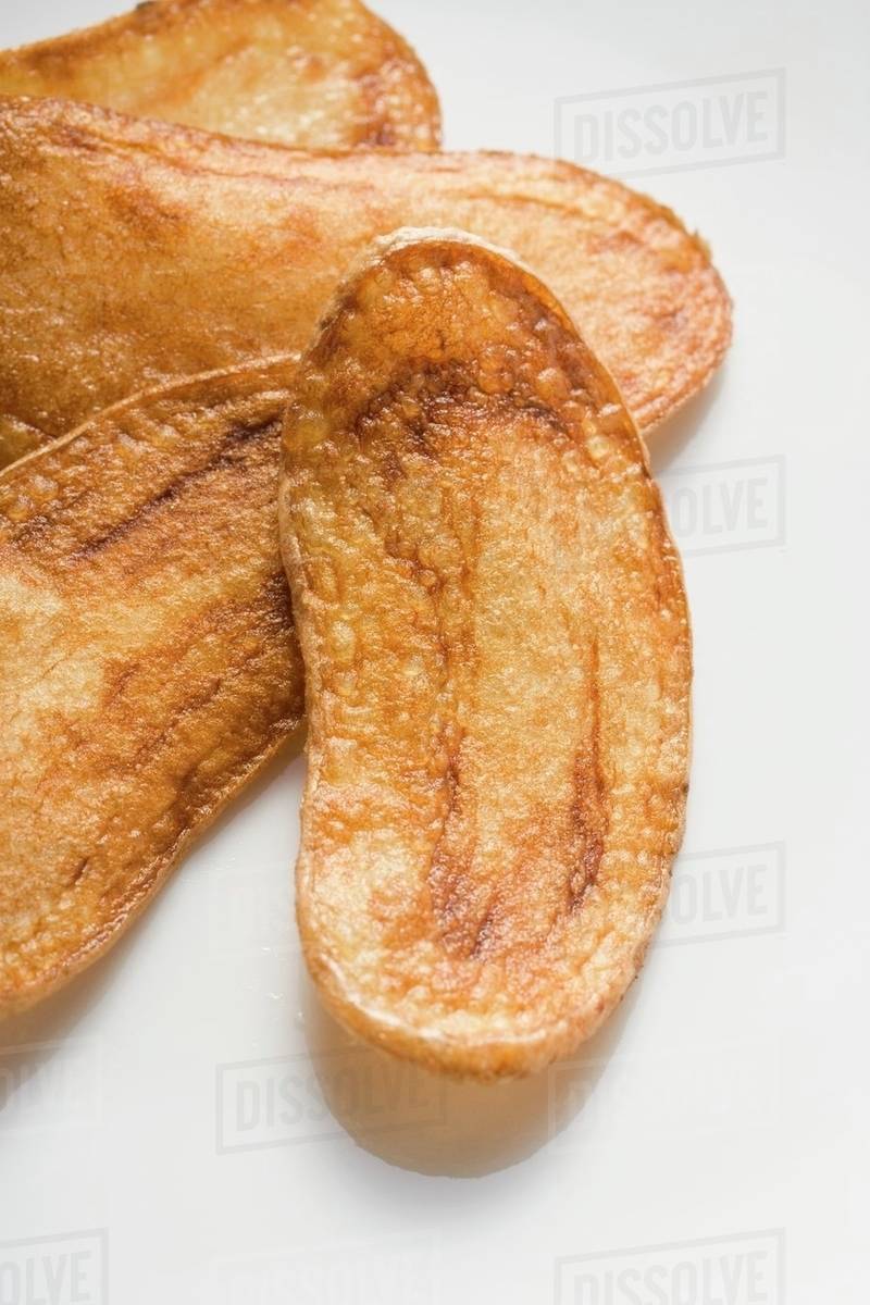Home-made potato crisps - Stock Photo - Dissolve
