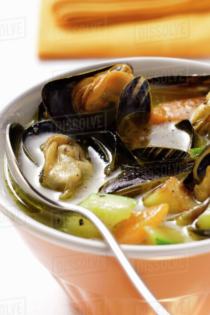 Mussel soup with courgettes - Royalty-free Stock Photo | Dissolve