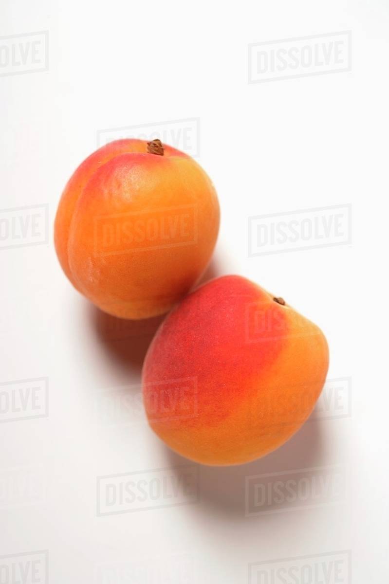 Two apricots - Royalty-free Stock Photo | Dissolve