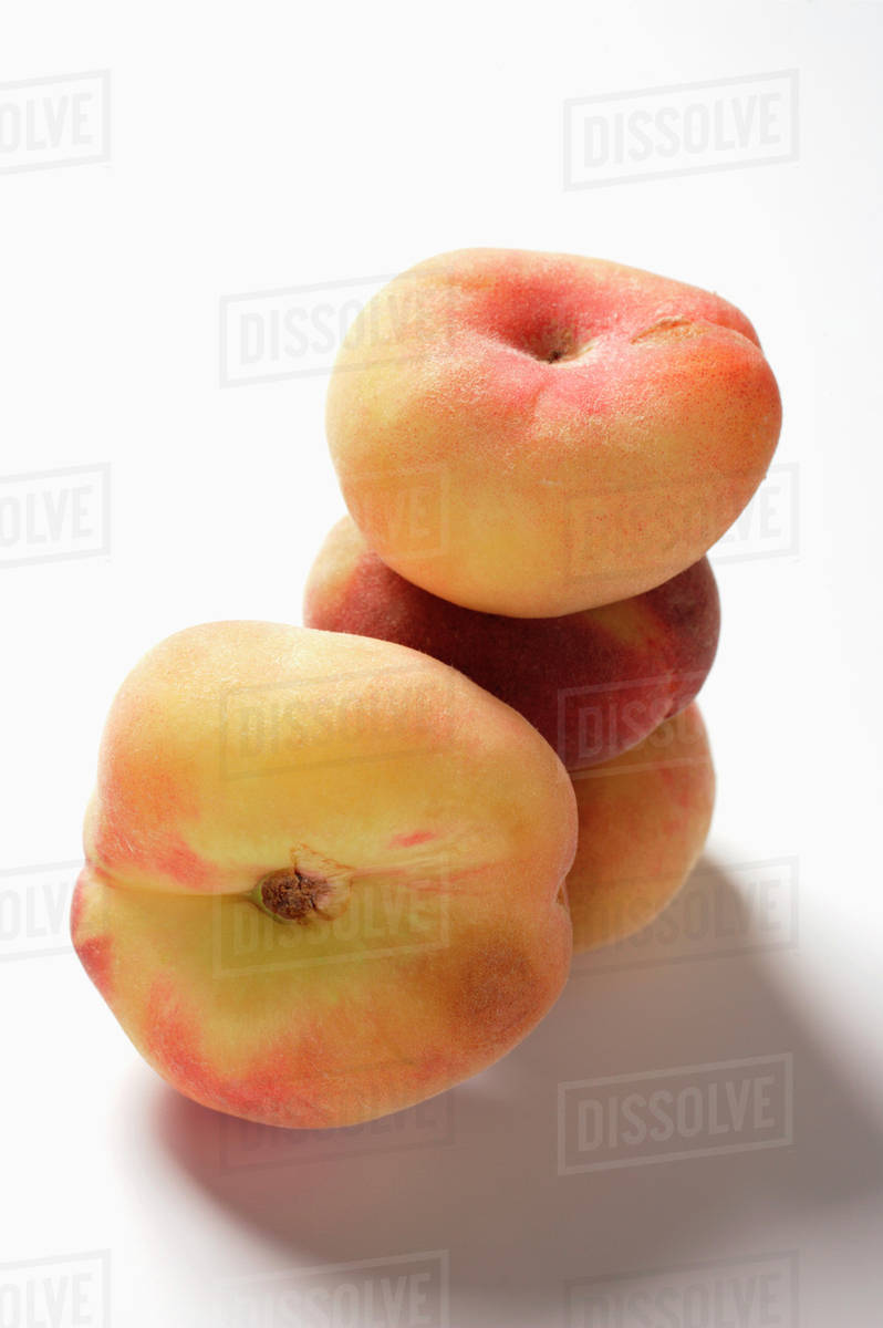 Four peaches (old variety) - Royalty-free Stock Photo | Dissolve